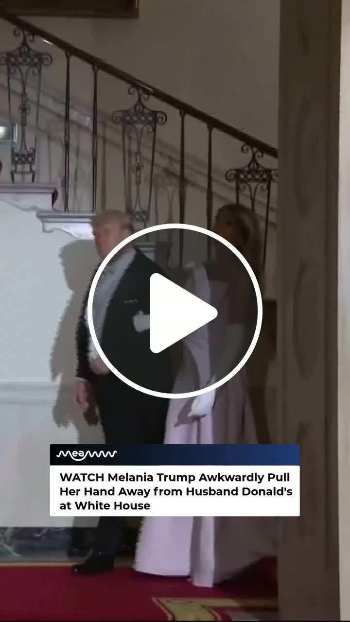 Melania Trump appears to pull her hand away from Donald Trump while ...