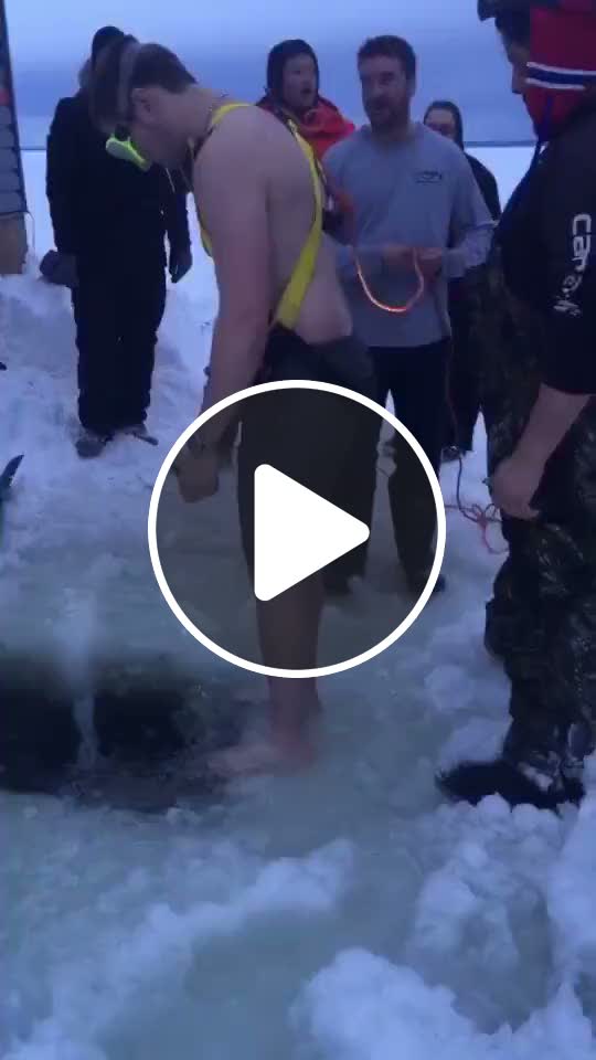 Guy loses his phone in a frozen lake so his friends help him retrieve ...