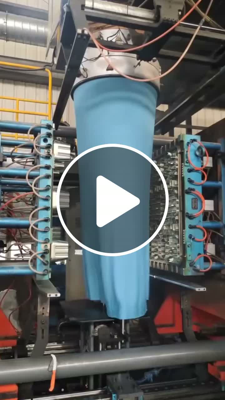 This press expands molten plastic inside a massive mold to form pallet ...