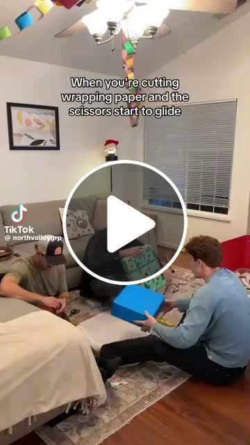 Watch these perfectly satisfying scissors cuts through wrapping paper ...