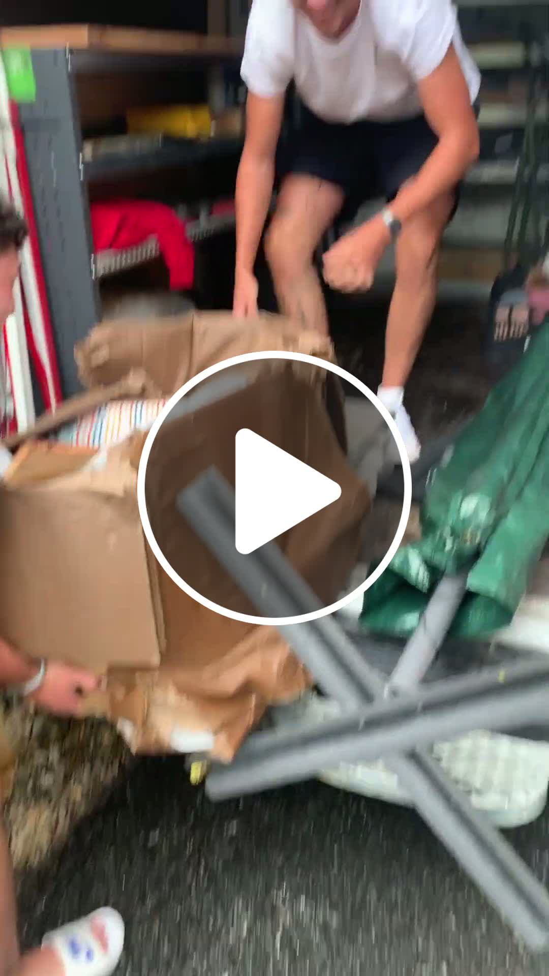 Guy falls face first into a box hes trying to unload out of a truck ...