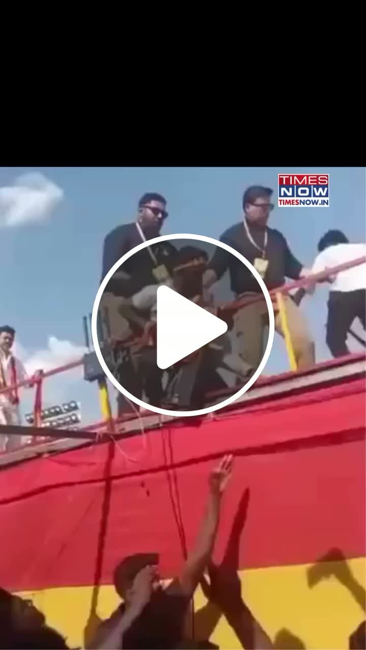 Actor Vijays bouncer pushes a TVK worker off stage during the leaders ...