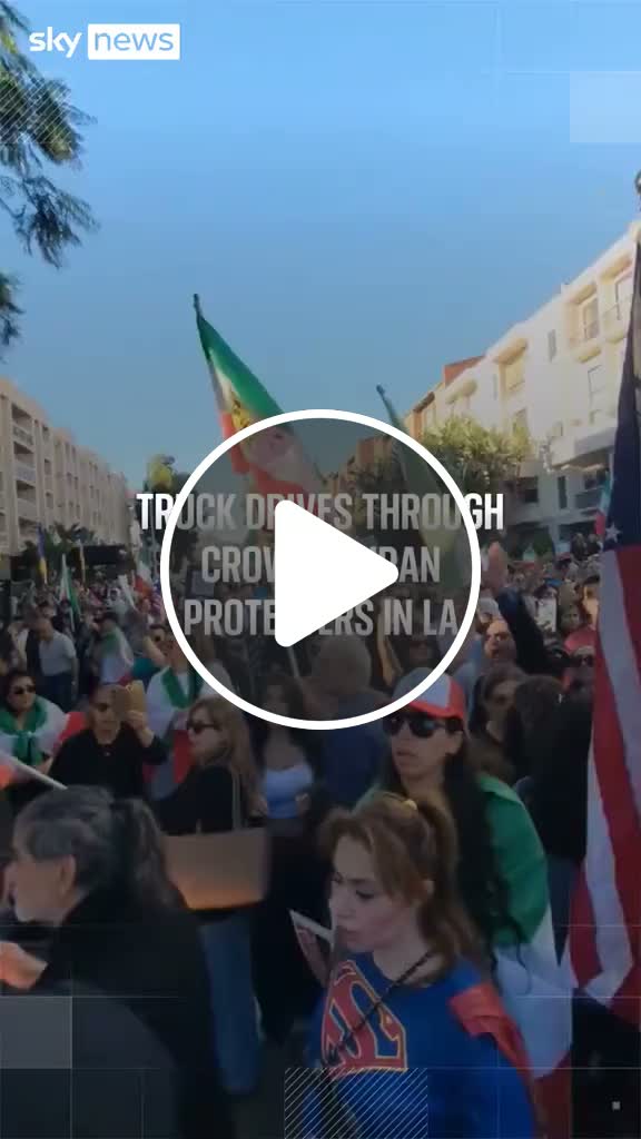 Footage shows protesters scrambling out of the way of a moving truck ...