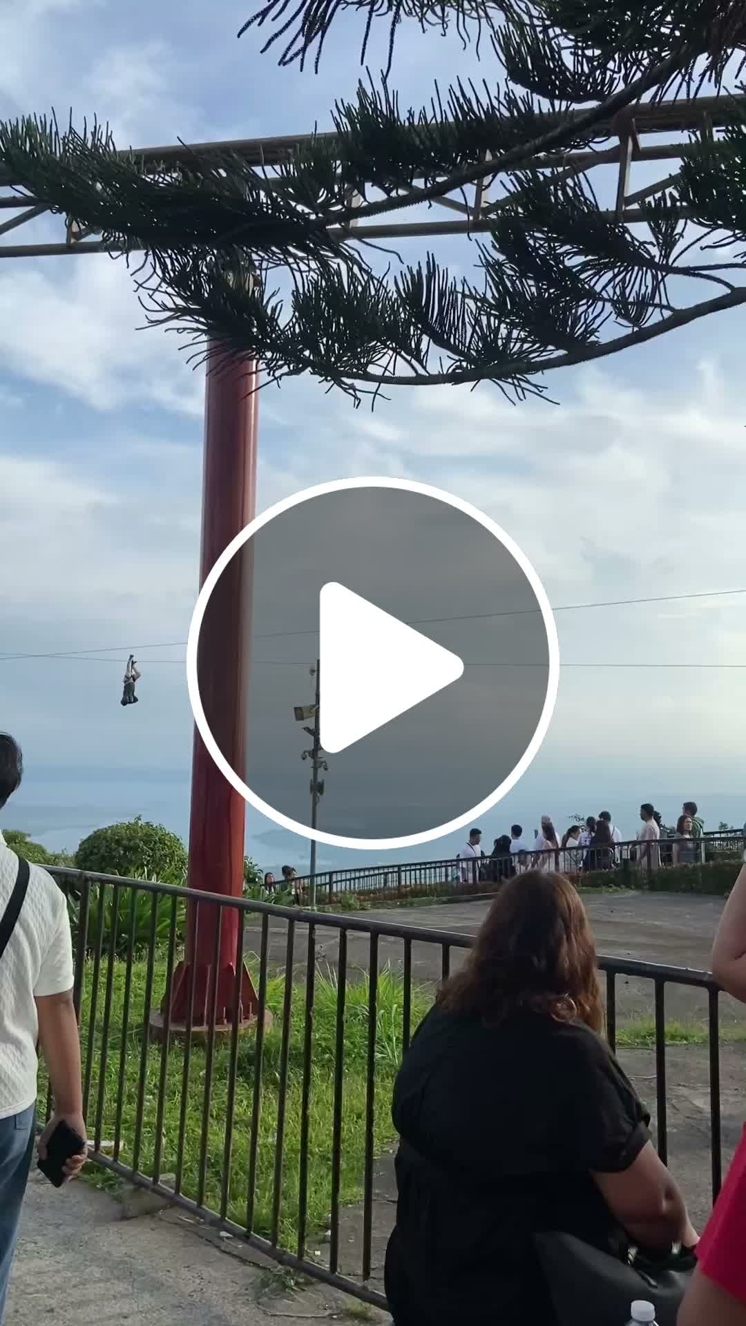 Man rides a zipline upside down in front of a crowd in Tagaytay ...