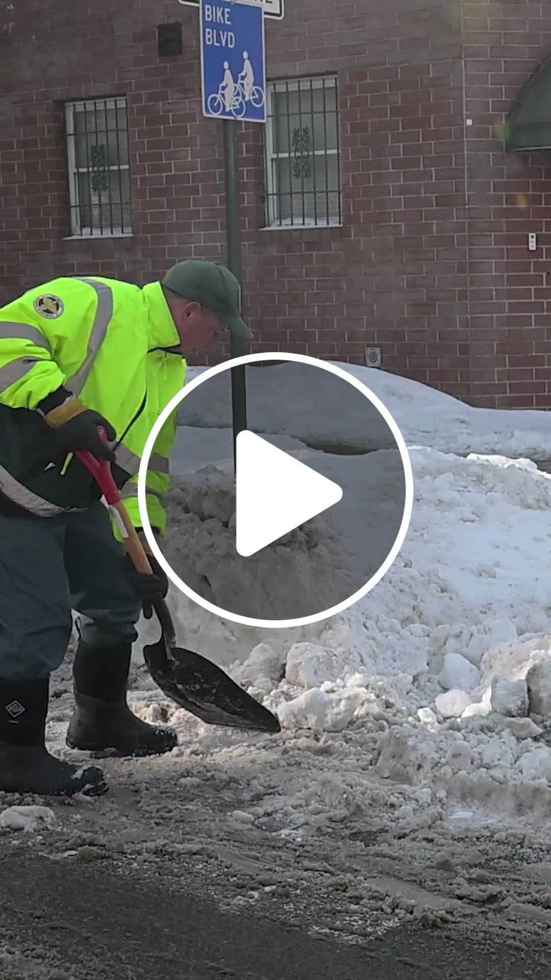 DSNY workers remove snow by hand in Park Slope - NewsBreak