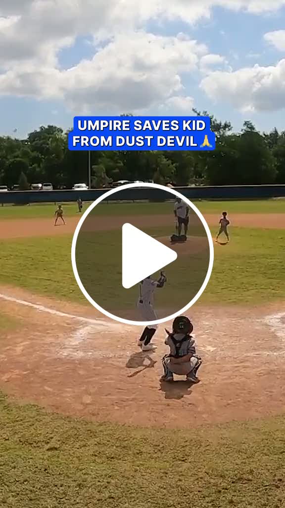 Heroic umpire saves boy from dust devil 👏 📸Kyle Englund via Storyful # ...