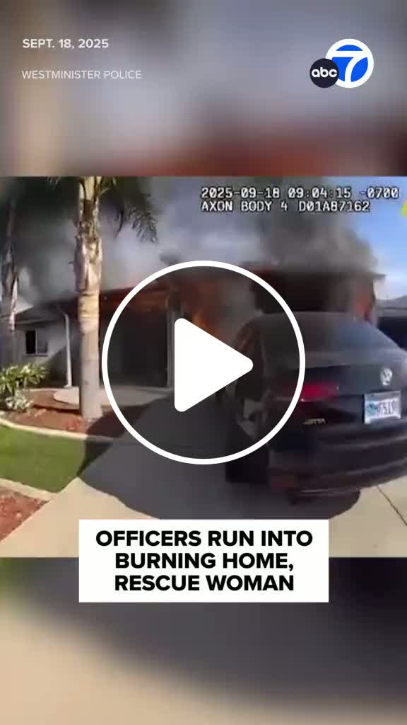 Dramatic body camera video shows police officers running into a burning ...