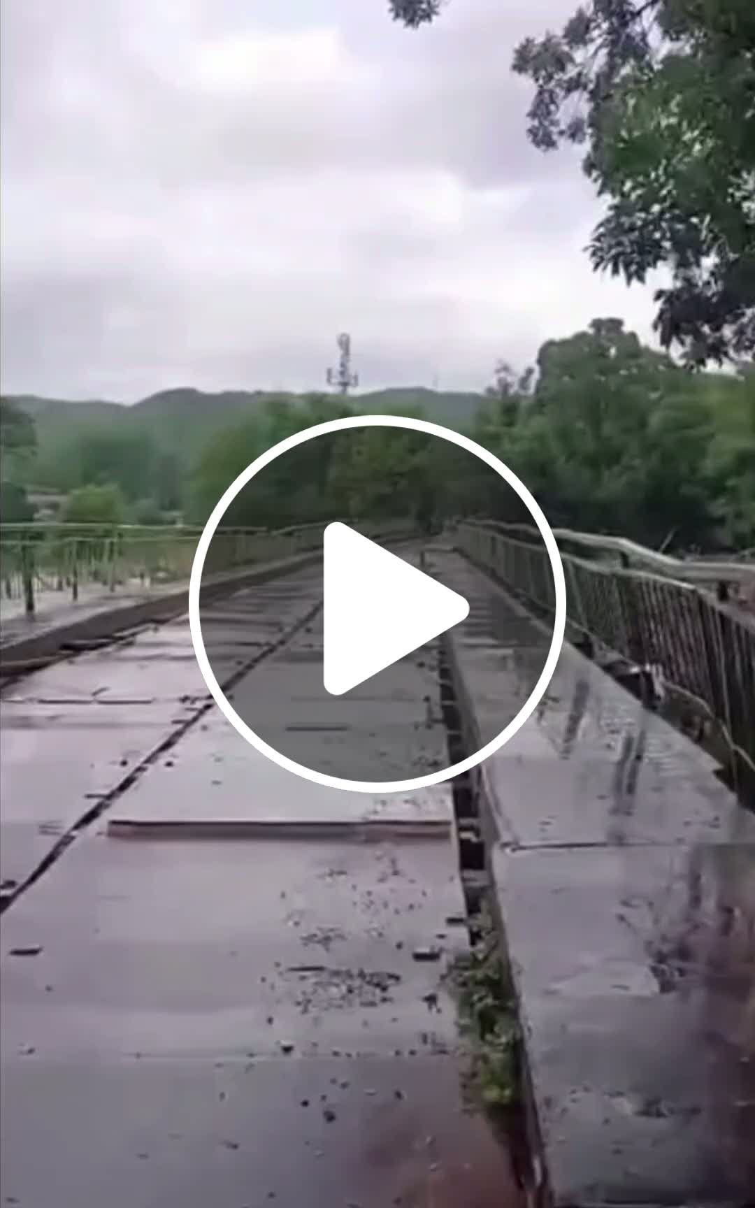A flash flood in Russia takes out a bridge. - NewsBreak
