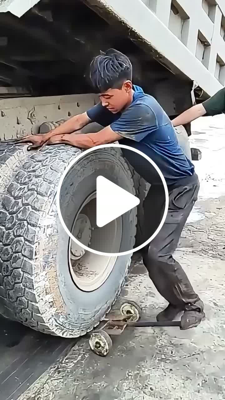 Use a power-assisted trolley to remove the wheels of a heavy-duty truck ...