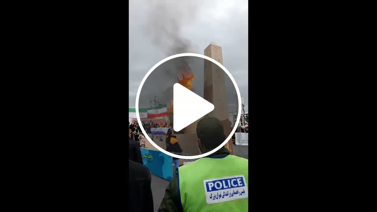 Iran: Iranian protesters burn a statue with the inscription "Baal ...