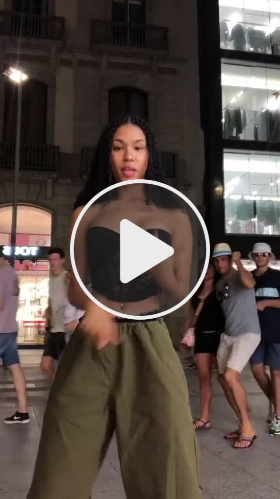 Girl is dancing on the street and people passing behind her start dancing too shorts - NewsBreak