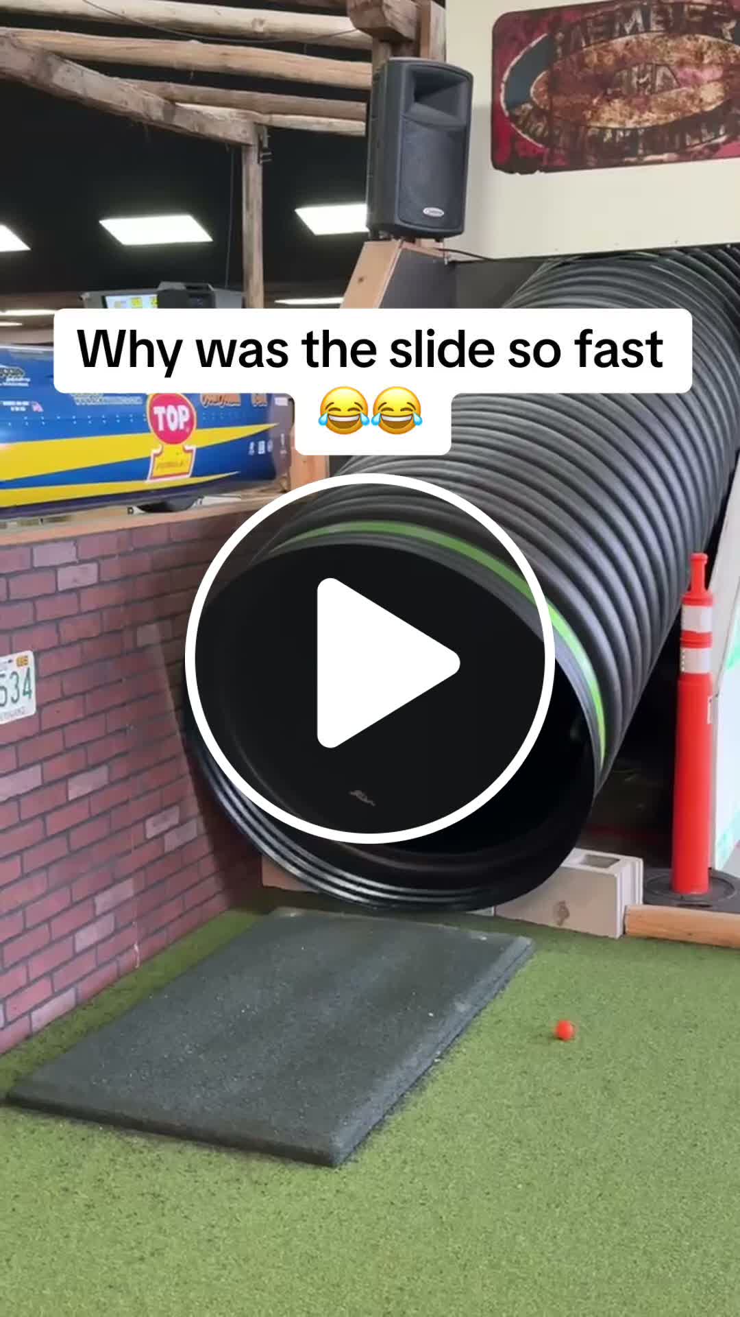 Two men fall out of the slide on a mini golf course - NewsBreak